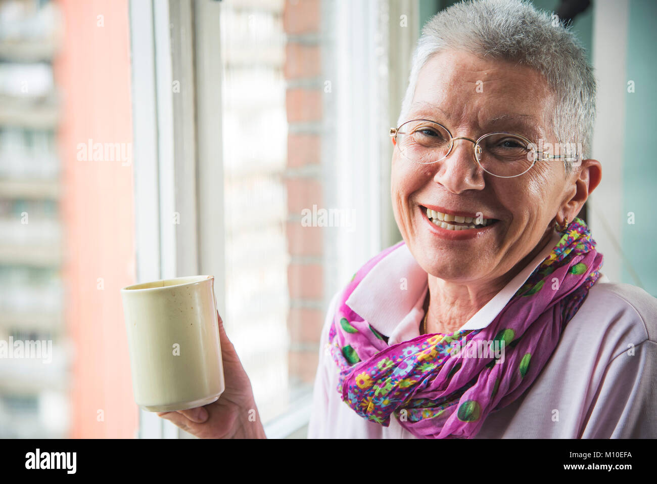Grandma enjoying her morning coffee Stock Photo - Alamy