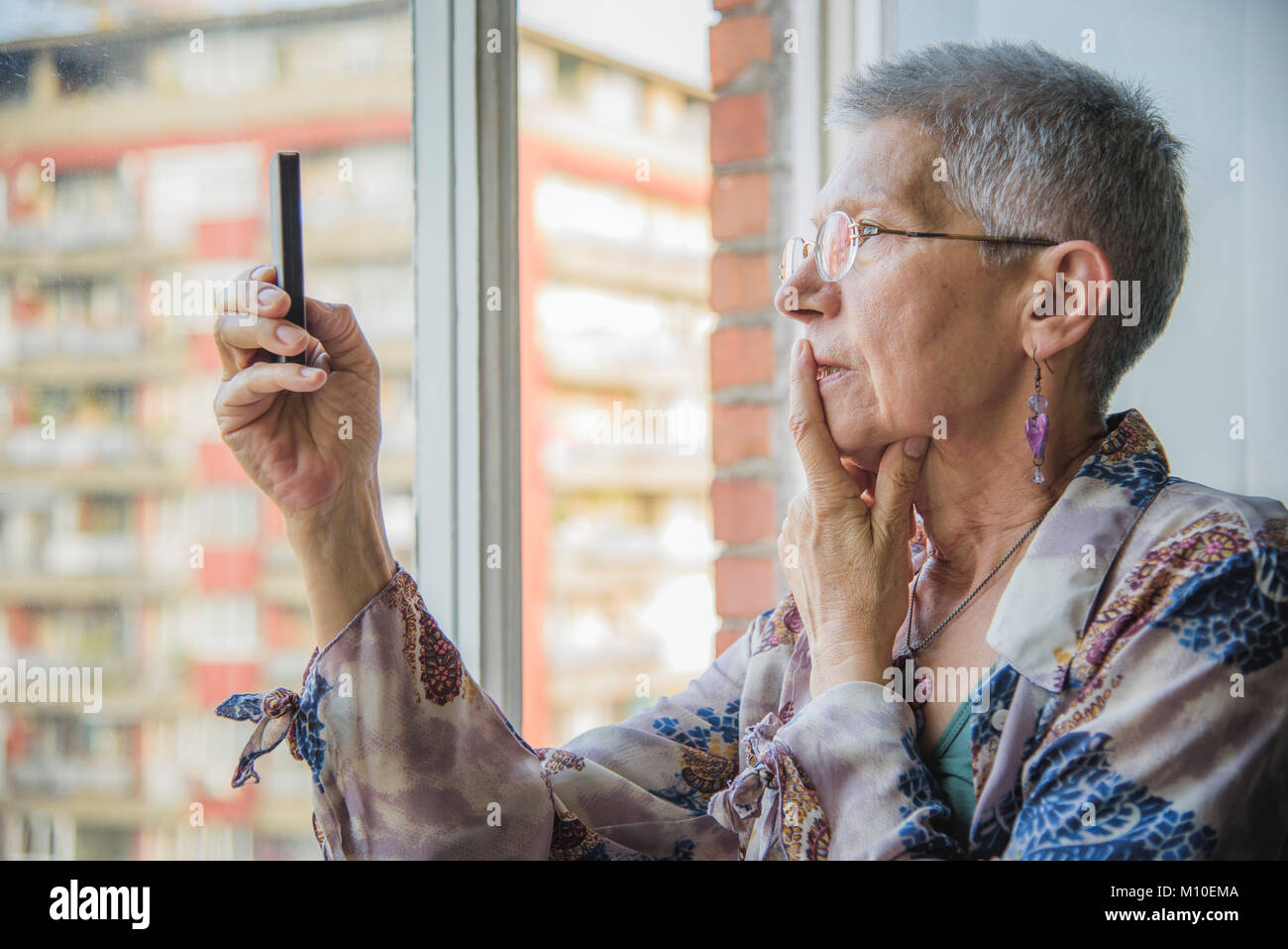 Confused mature old granny grandmother hi-res stock photography and ...