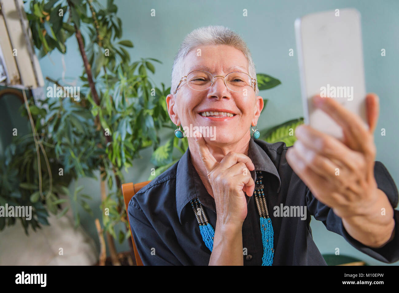 Grandma using a video chat app Stock Photo - Alamy