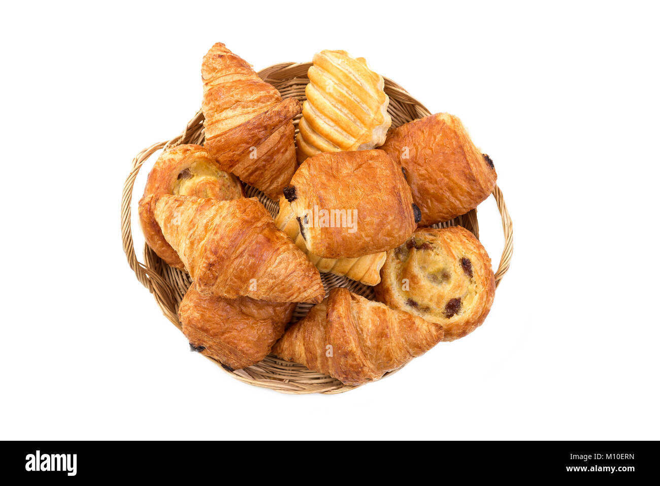 basket of assortment of pastries breakfast food on white copy space ...