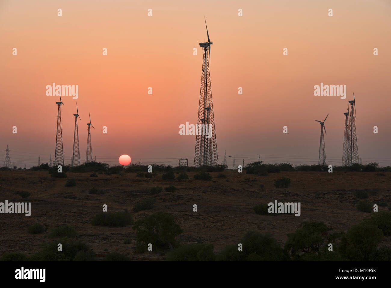 Windmills in the Thar Desert at sunset, Rajasthan, India Stock Photo ...