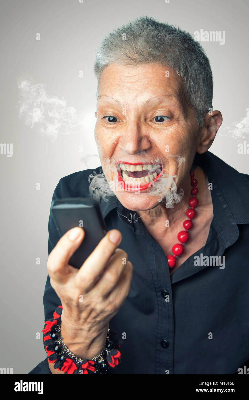 Older woman phone upset hi-res stock photography and images - Alamy