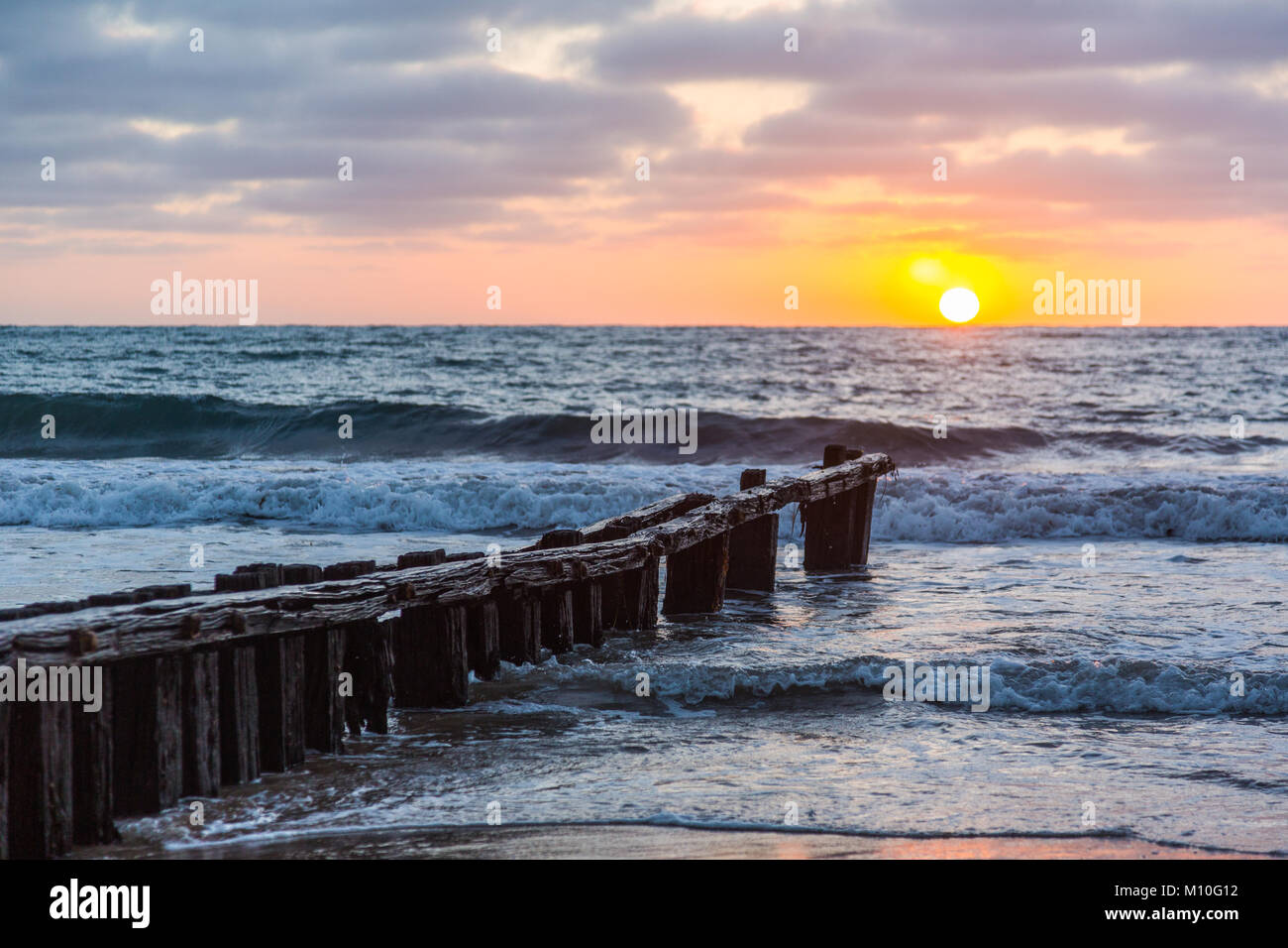 Sunrise over the erosion Groynes in Victor Harbor Stock Photo - Alamy