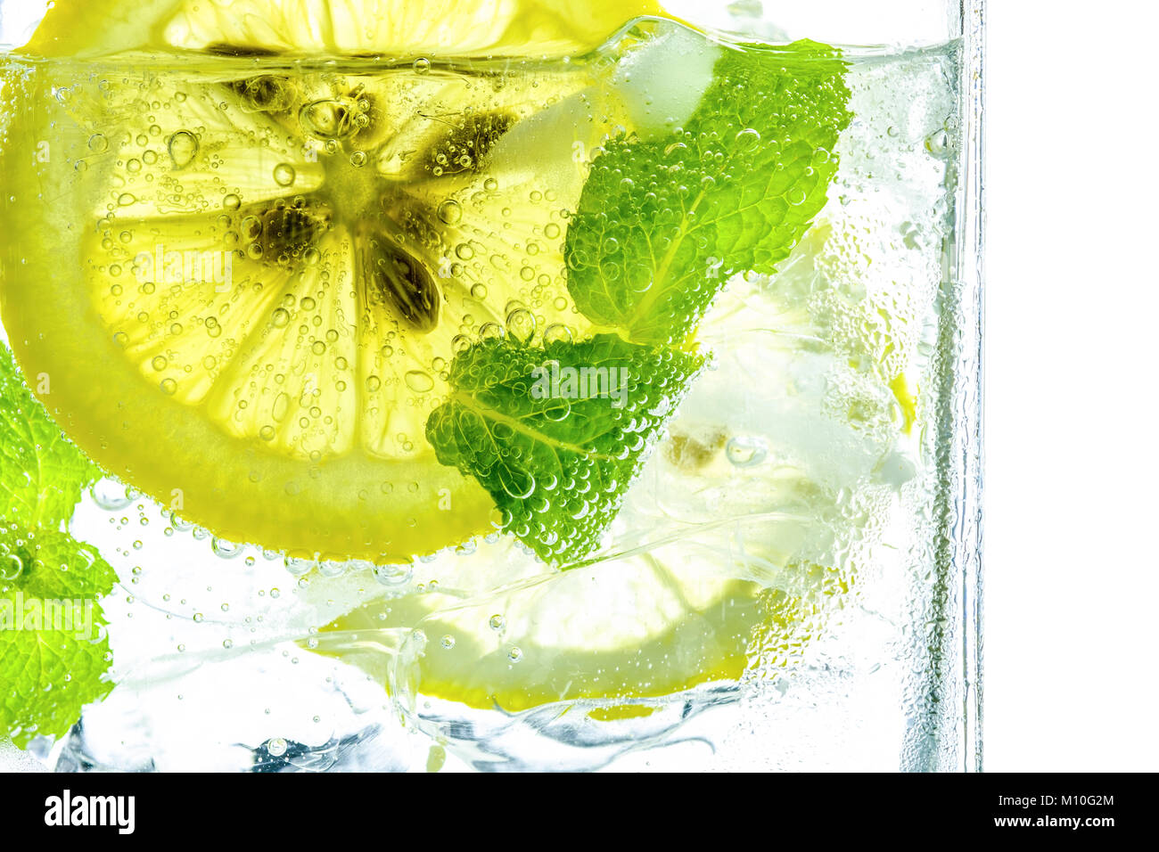 Lemon drop in fizzy sparkling water, juice refreshment Stock Photo - Alamy