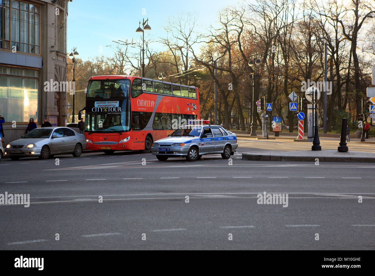 Saint-Petersburg, Russia - October 27, 2012: Tourist bus and police car ...