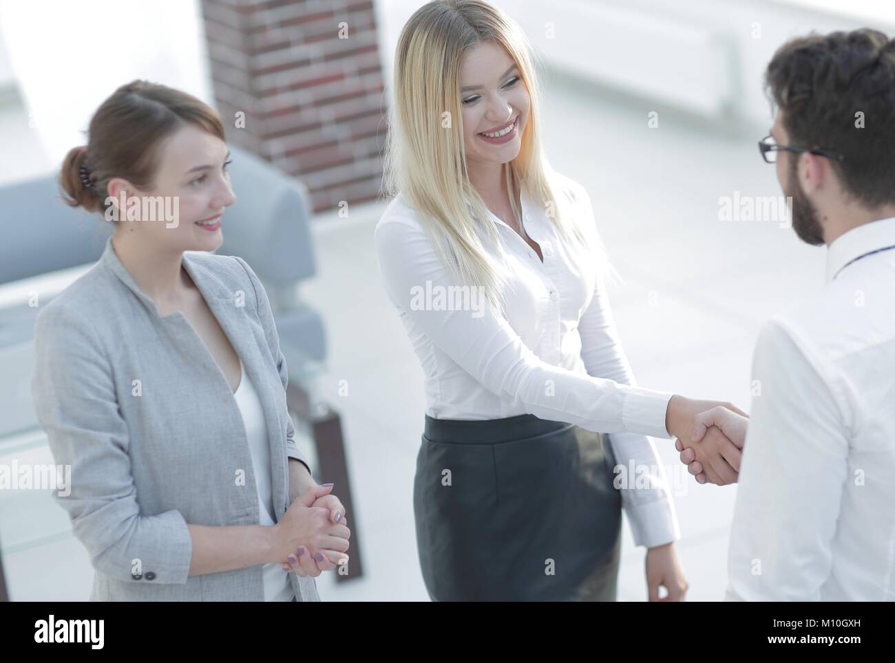 handshake business partners in the office Stock Photo - Alamy