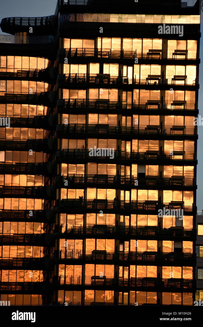 Reflections of a sunset in an Office Block and windows in a vibrant ...