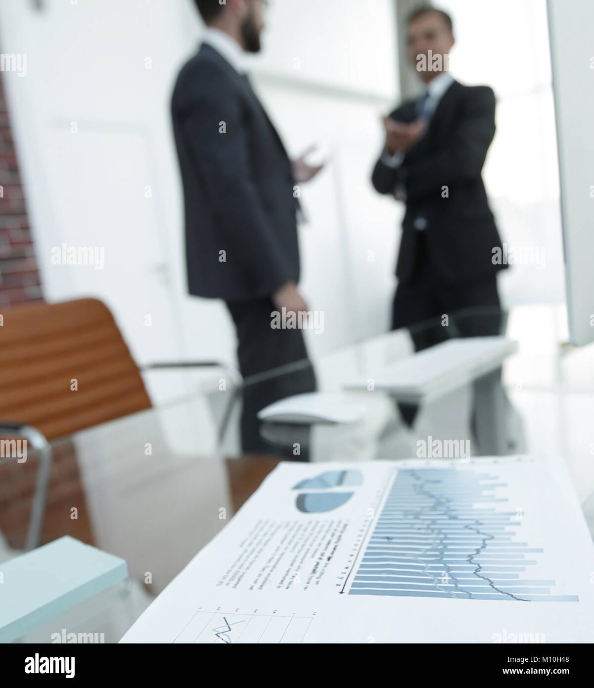 financial graph on the desktop in the office Stock Photo - Alamy