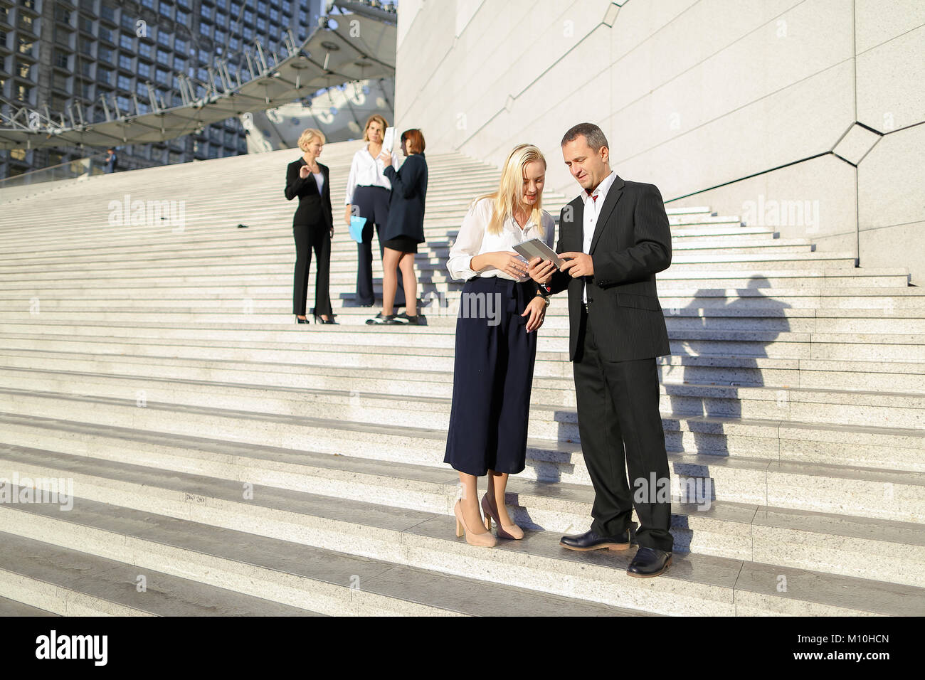 Successful business team walking on stairs in Stock Photo - Alamy