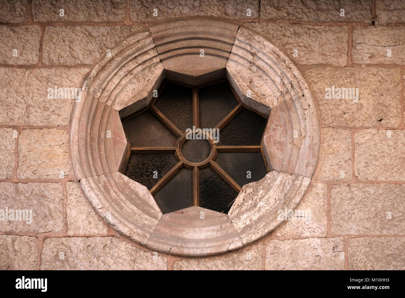 Round window patterns adorn the façade of a building, built by the ...