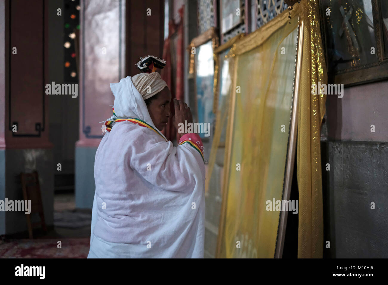 An Ethiopian orthodox worshipper praying inside the Ethiopian Church of ...