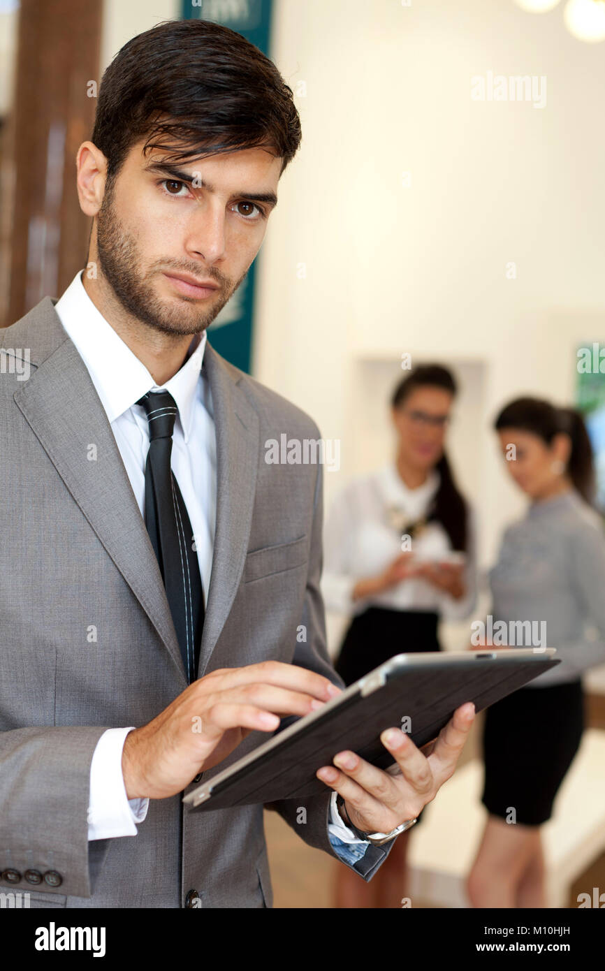 Portrait of business man in an office environment Stock Photo - Alamy