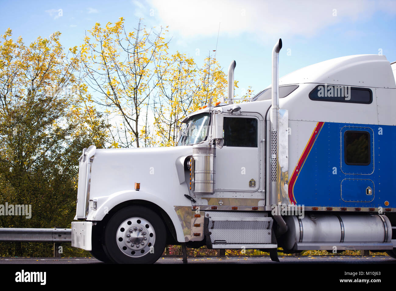 Profile of American idol popular big rig white and blue classic semi ...