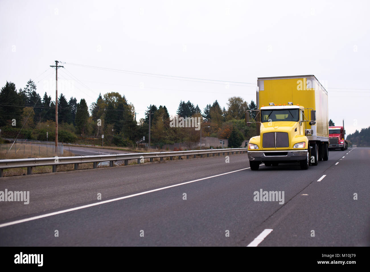 Yellow big rig semi truck with day cab for local delivery and box ...
