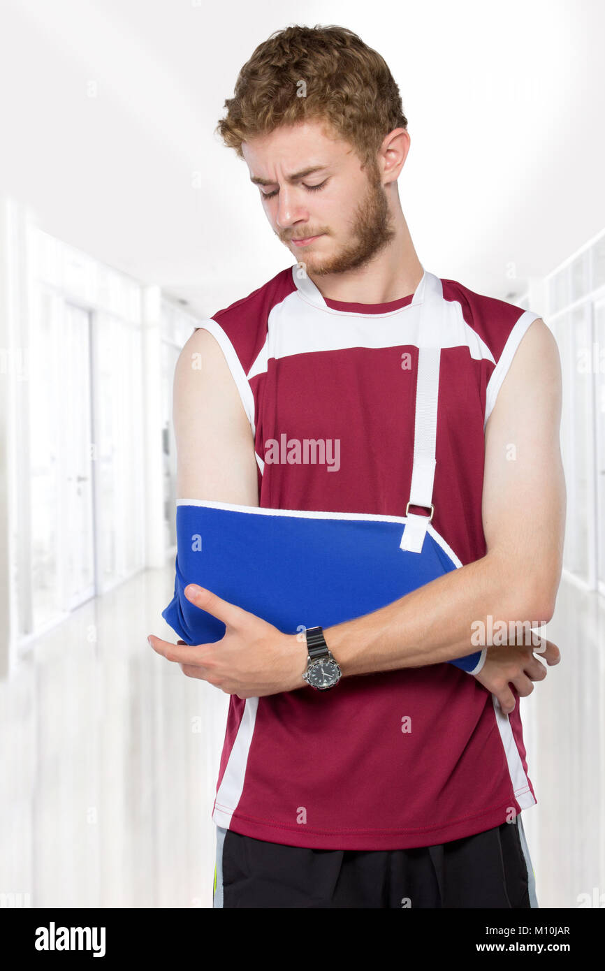 portrait of sport man with arm in a sling because training injury Stock ...