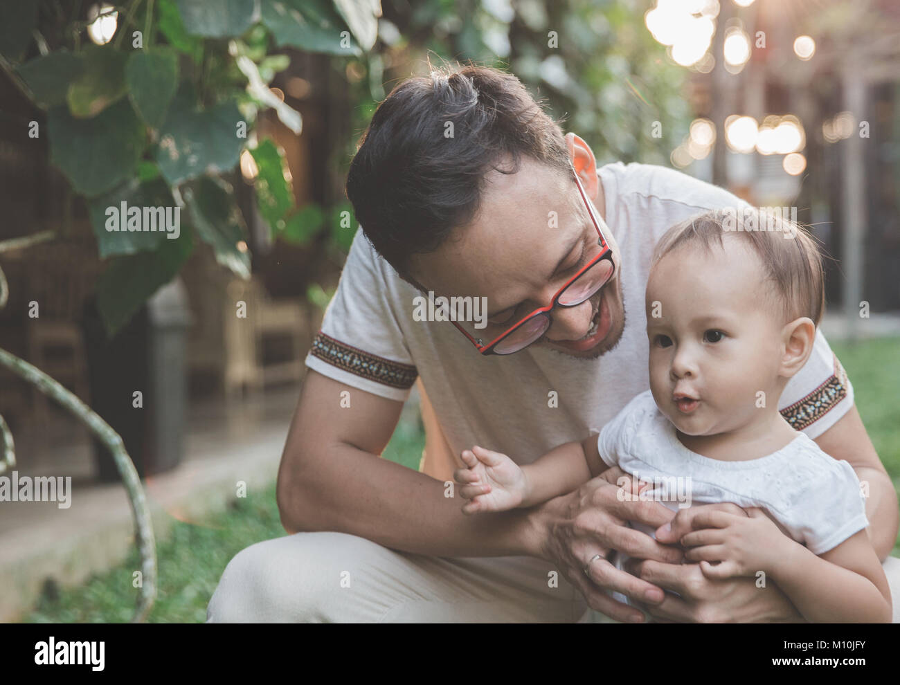 Father with his baby have fun in the park Stock Photo - Alamy