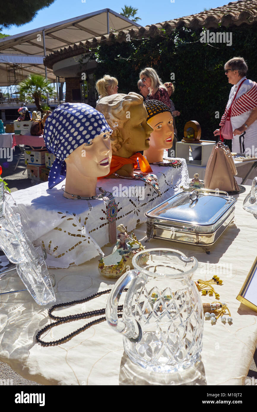 Open air flea market in St Maxime, France with art deco heads Stock ...