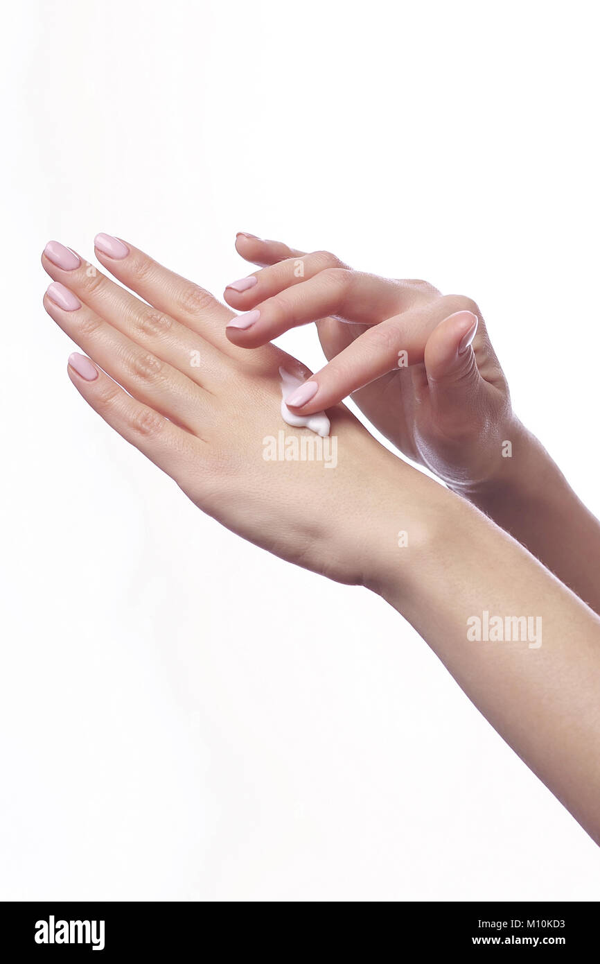 Beautiful woman's hands with white cosmetic care cream Stock Photo - Alamy