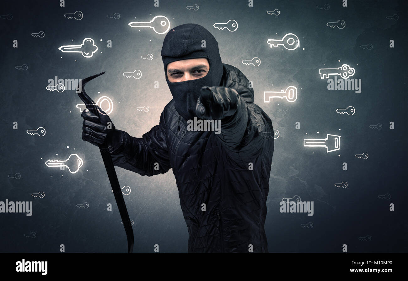 Burglar standing with tools in his hand Stock Photo - Alamy