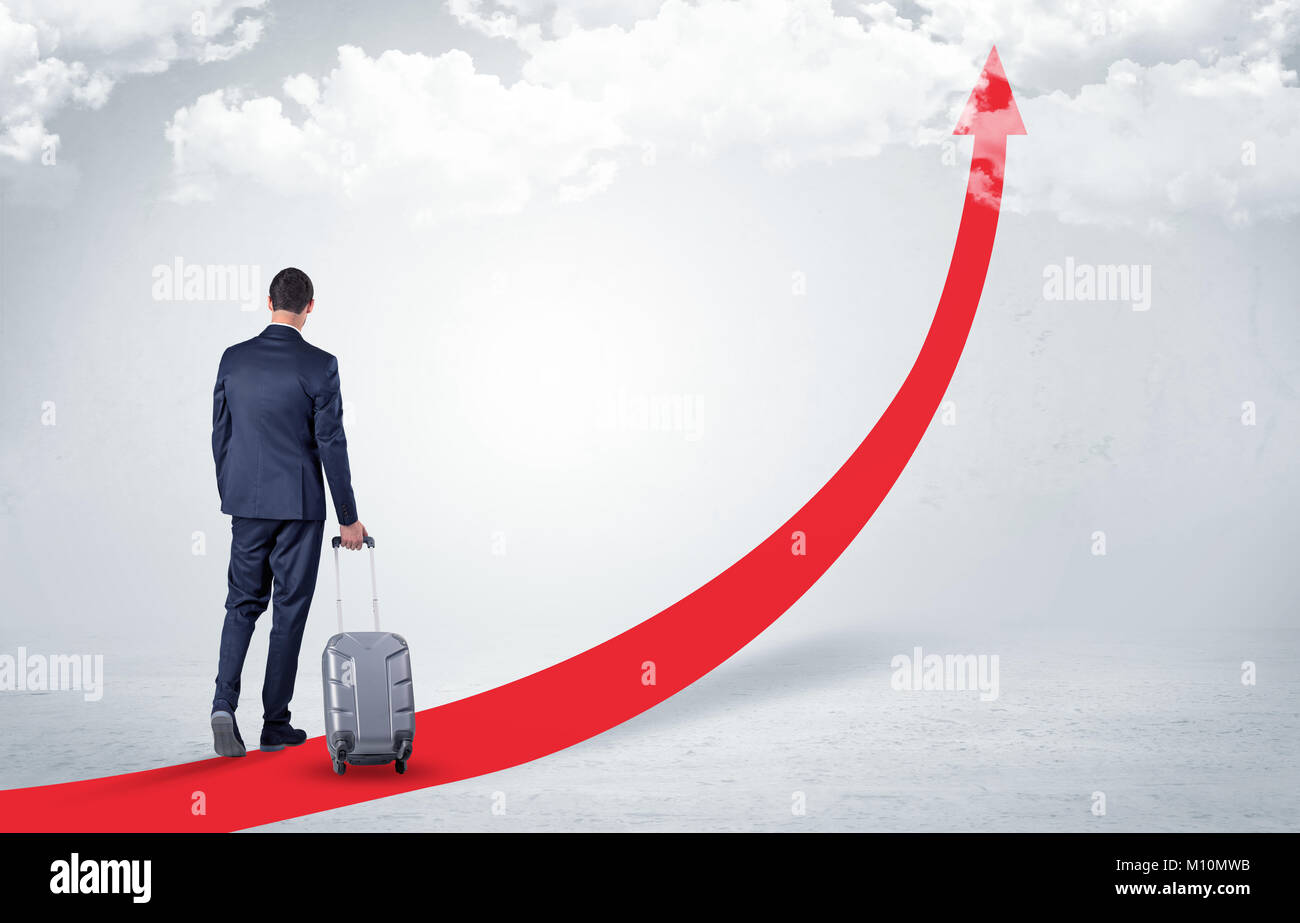 Young businessman with back leaving on the red arrow carpet to the ...