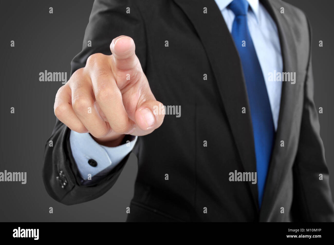 Business Man pushing on a touch screen interface. against black ...