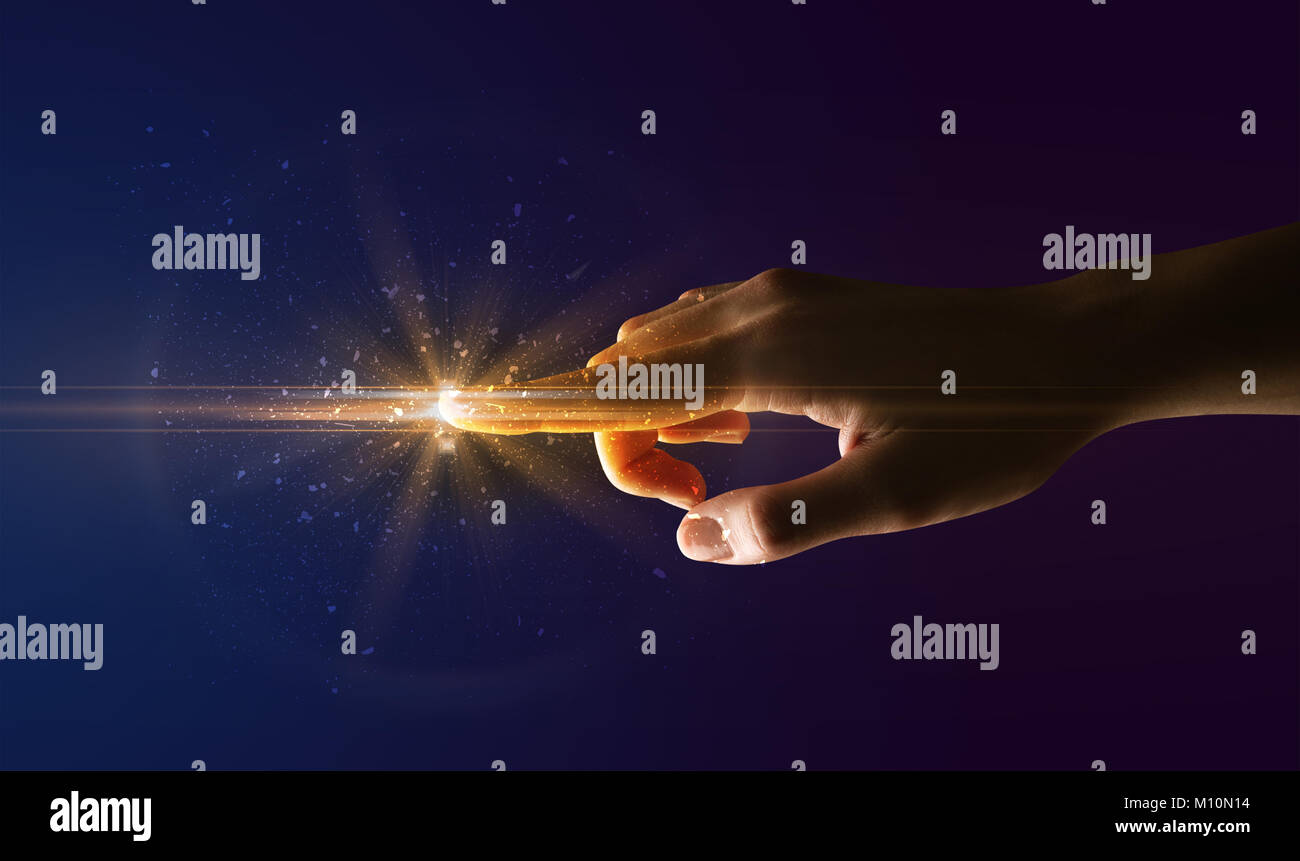 Female finger touching a beam of light Stock Photo - Alamy