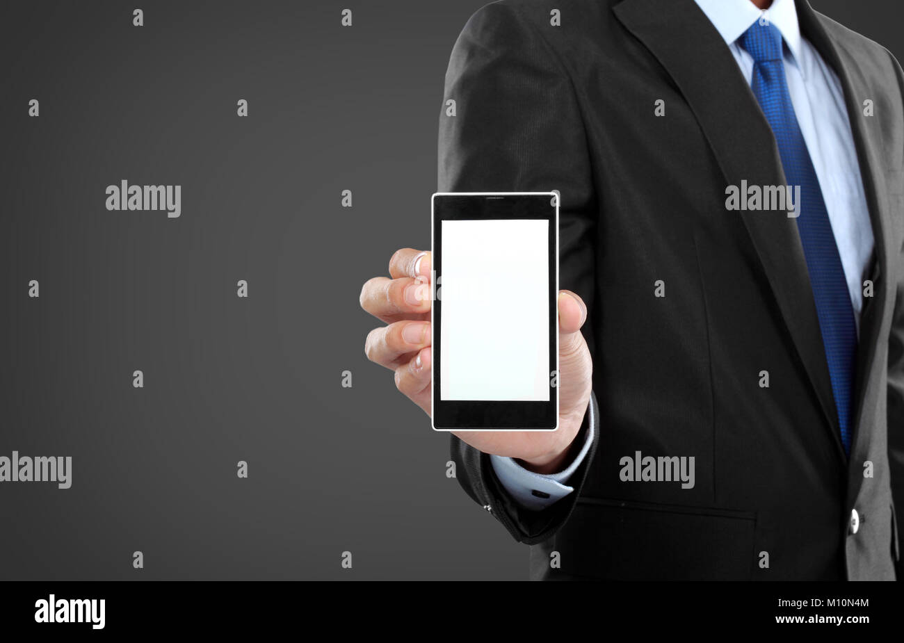 businessman holding mobile smart phone with blank screen. Isolated on ...