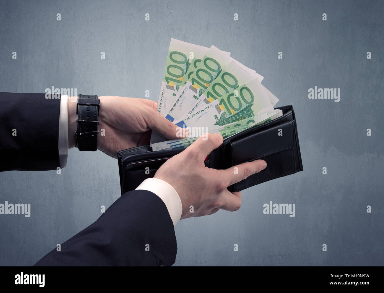 Money in wallet hand takes hi-res stock photography and images - Alamy