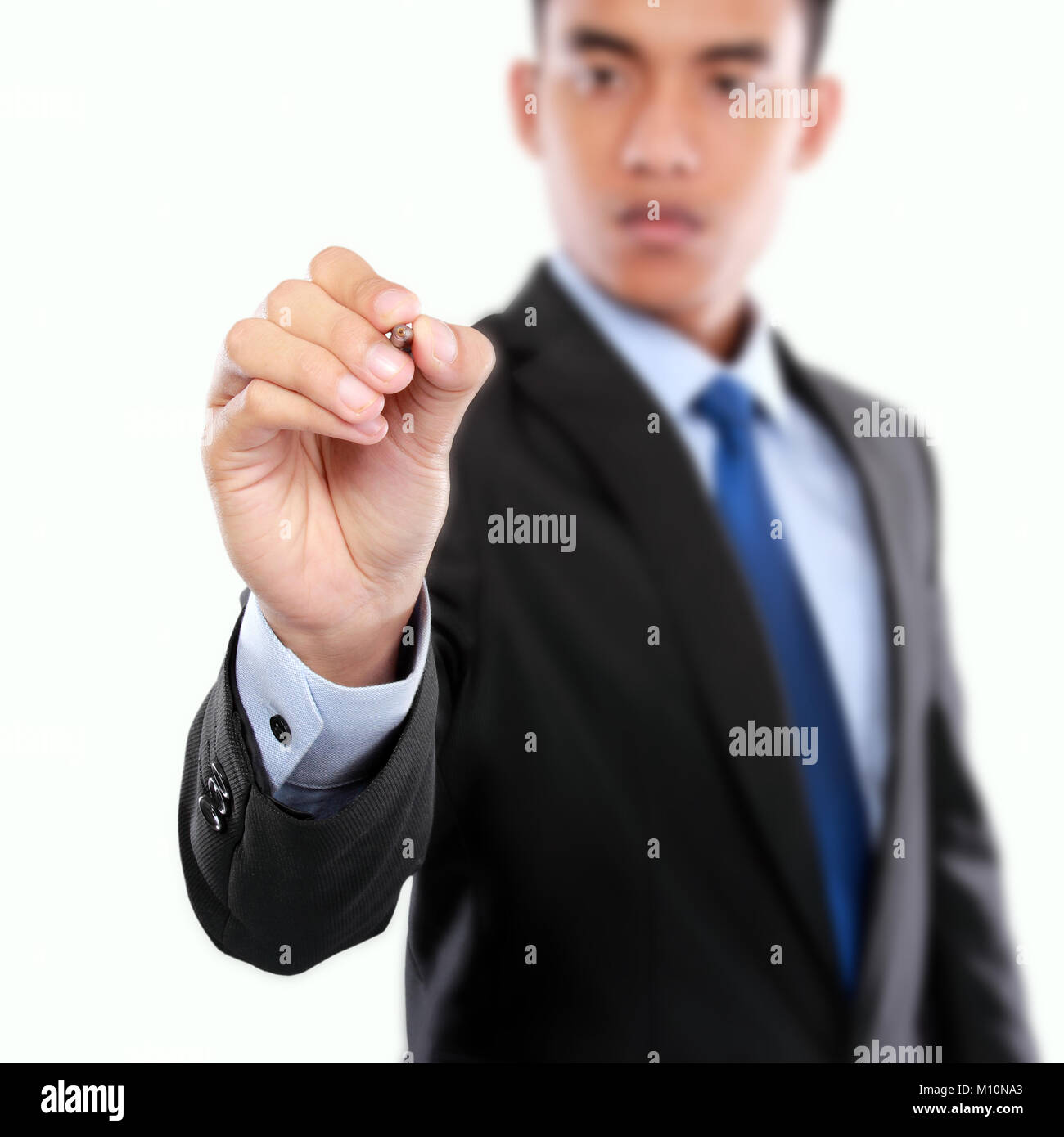 Business man writing or drawing to the blank space against white ...