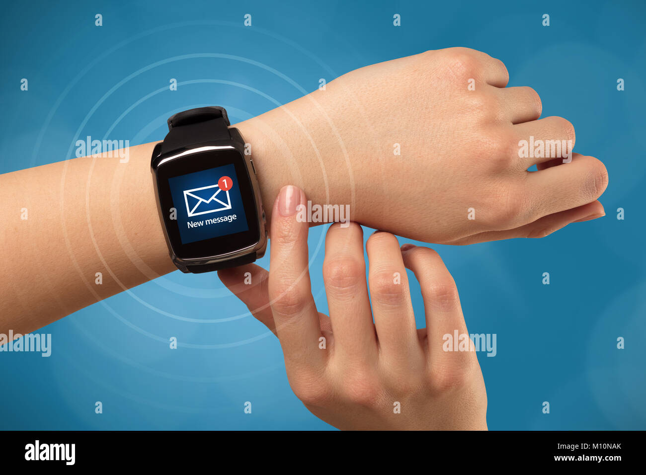 Female hand receives new message on her smartwatch Stock Photo - Alamy