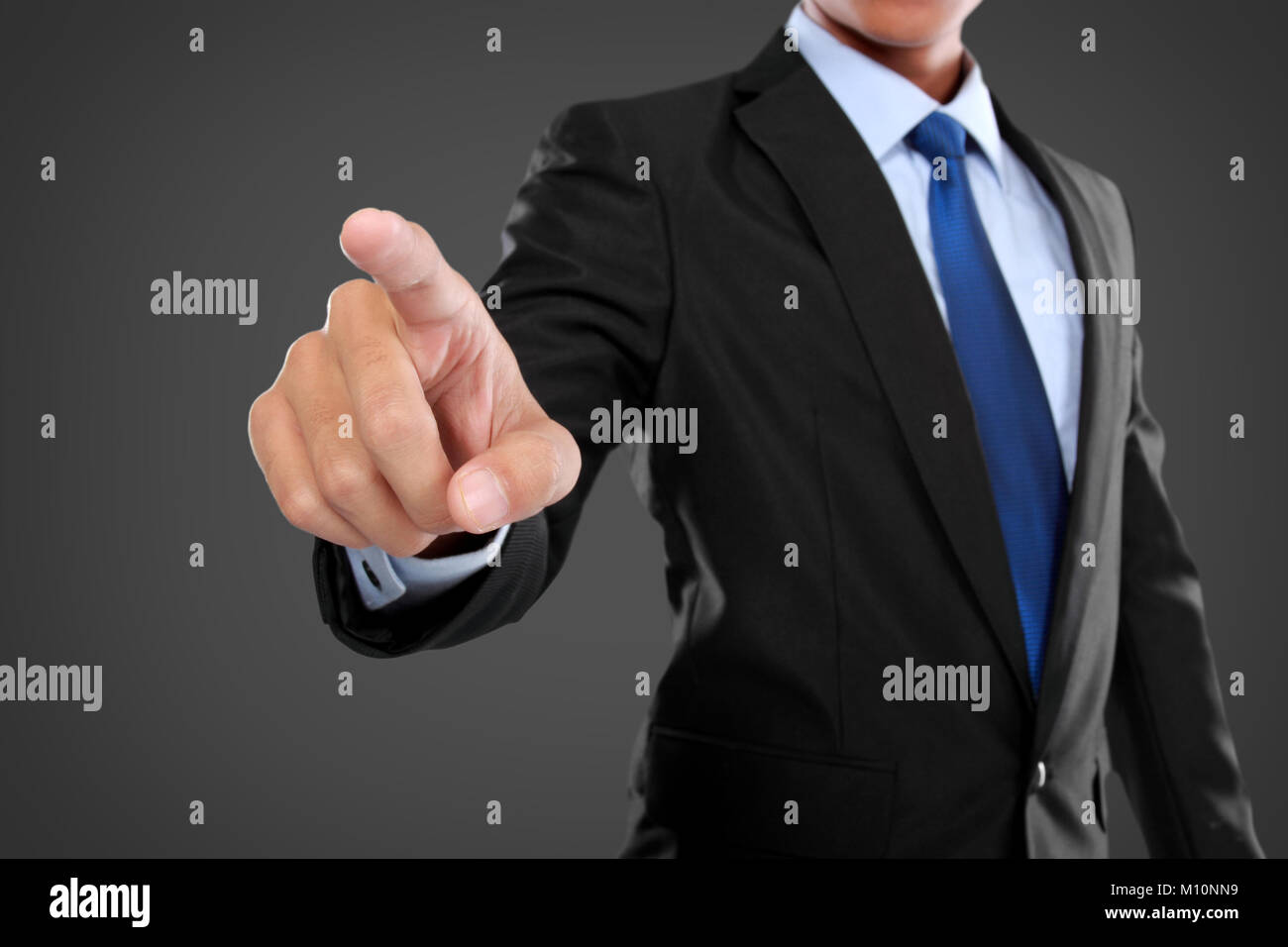 Business Man pushing on a touch screen interface. against black ...