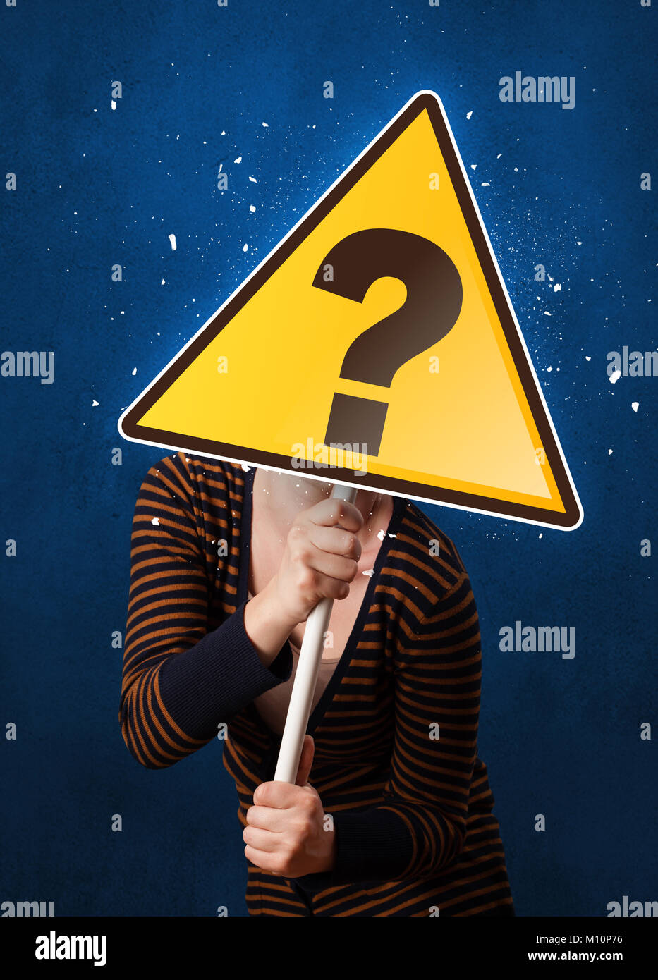 Casual young woman holding yellow sign with question mark Stock Photo ...