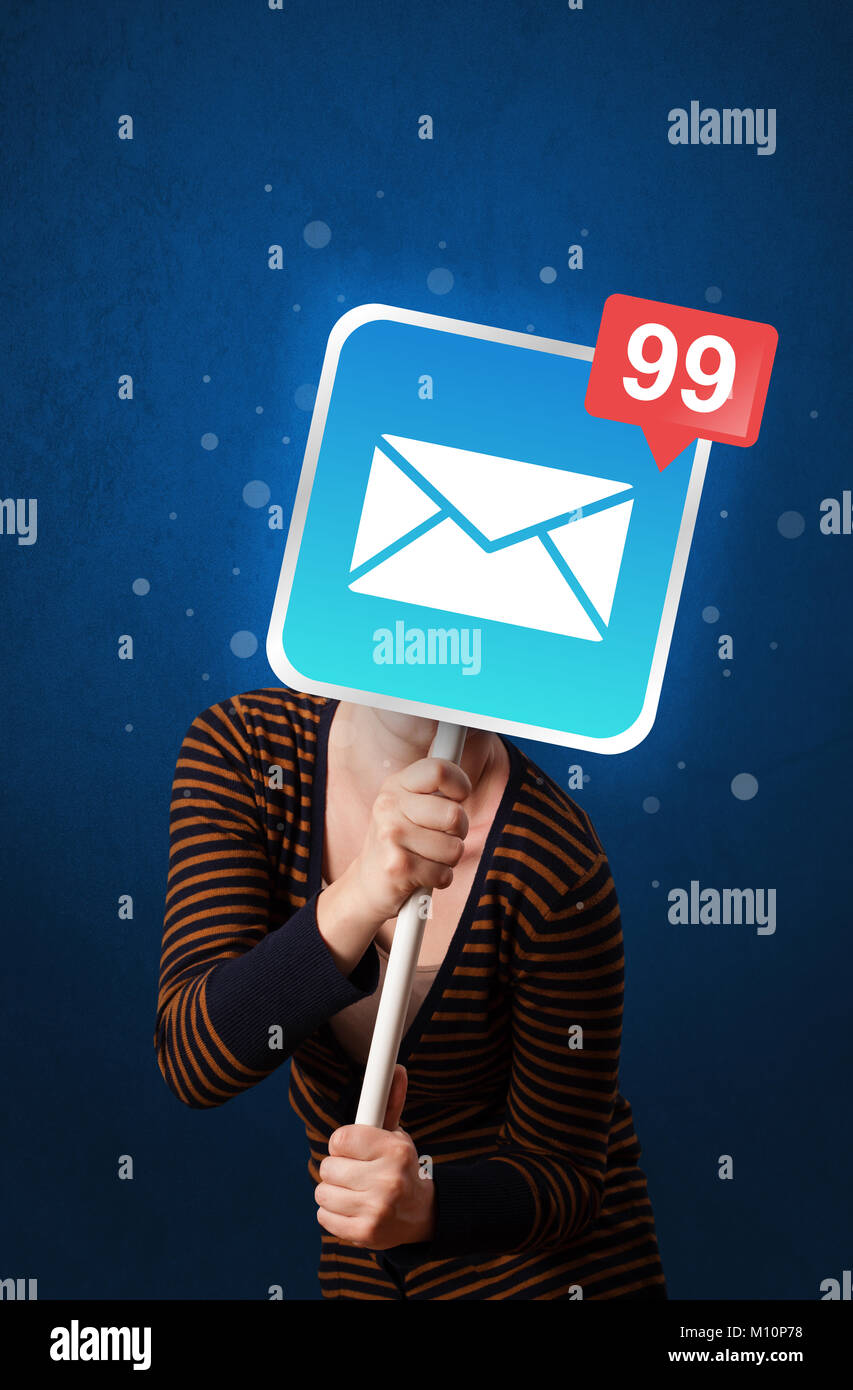 Casual young woman holding square sign with mail icon Stock Photo - Alamy