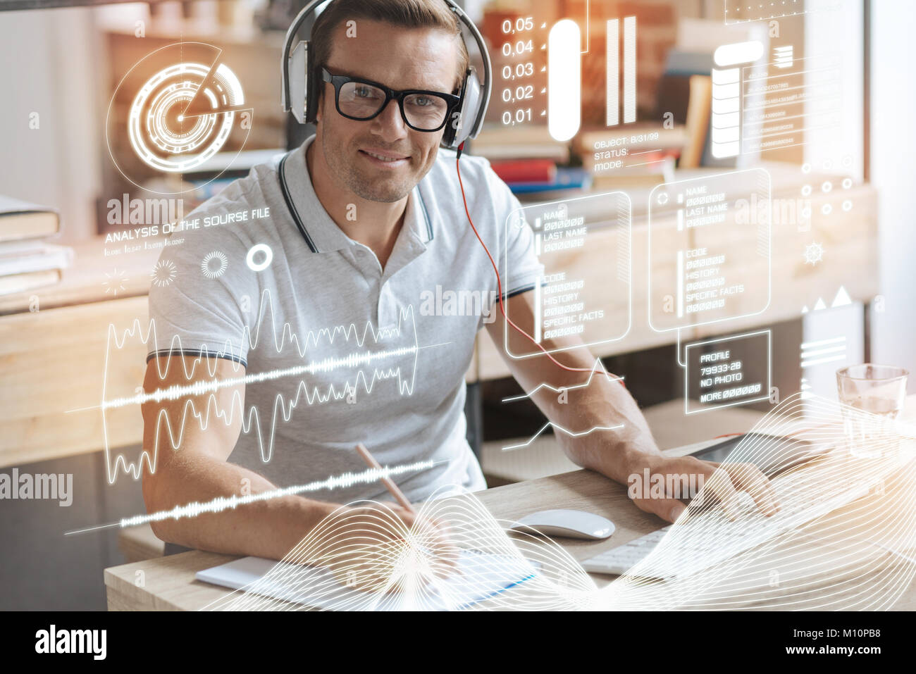 Handsome smiling man working on the project Stock Photo - Alamy