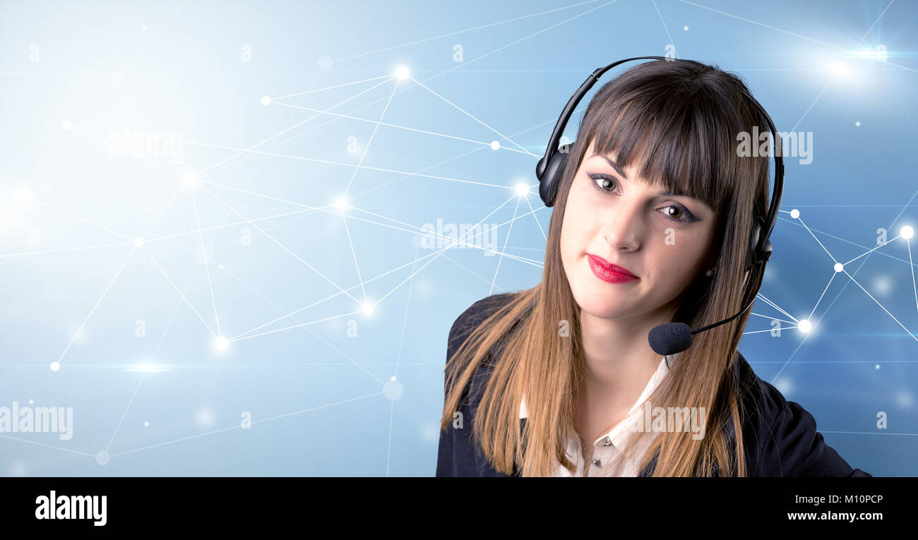 Young female telemarketer with blue background and connectivity concept ...