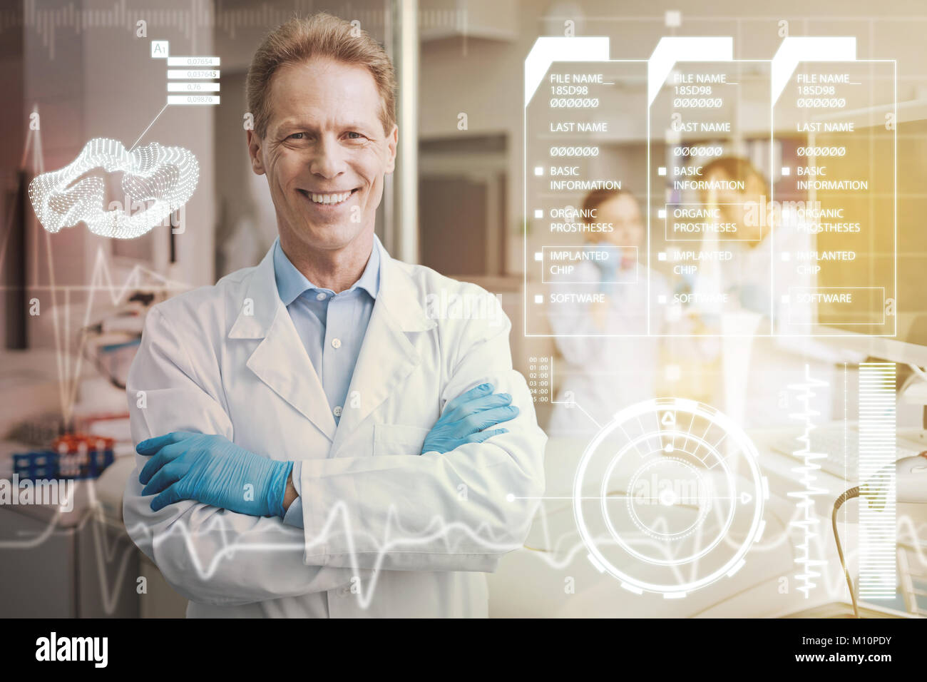 Clever cheerful doctor standing with his arms crossed and smiling Stock ...