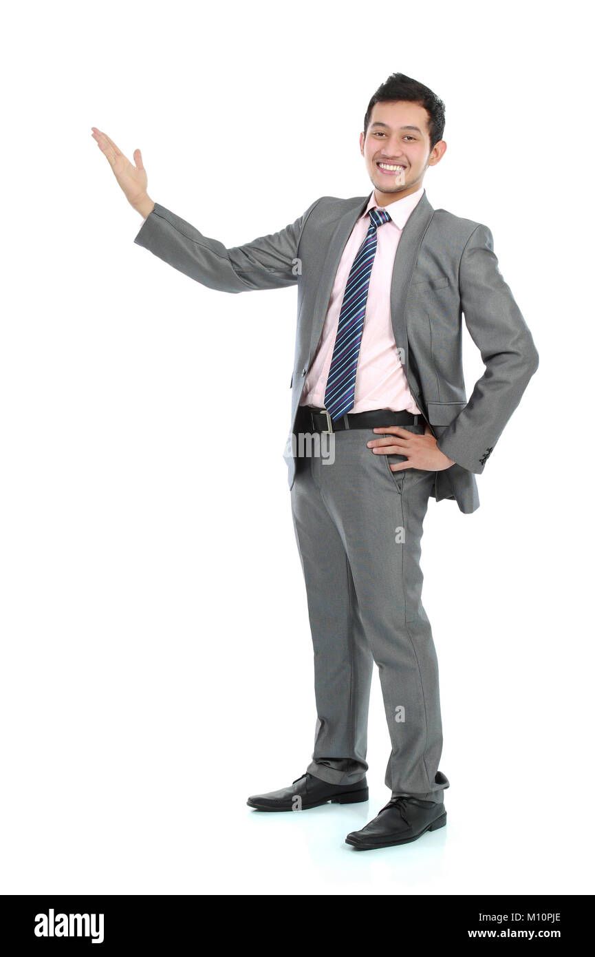 full body portrait of handsome young business man presenting on white ...
