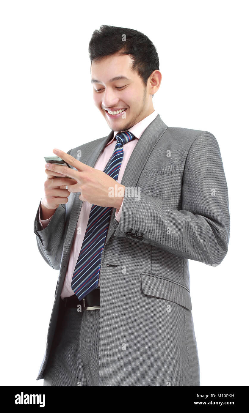 Young business man texting a message with phone isolated on white ...