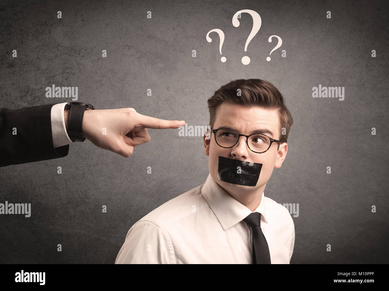 Caucasian business hand pointing at scared employee with big white ...