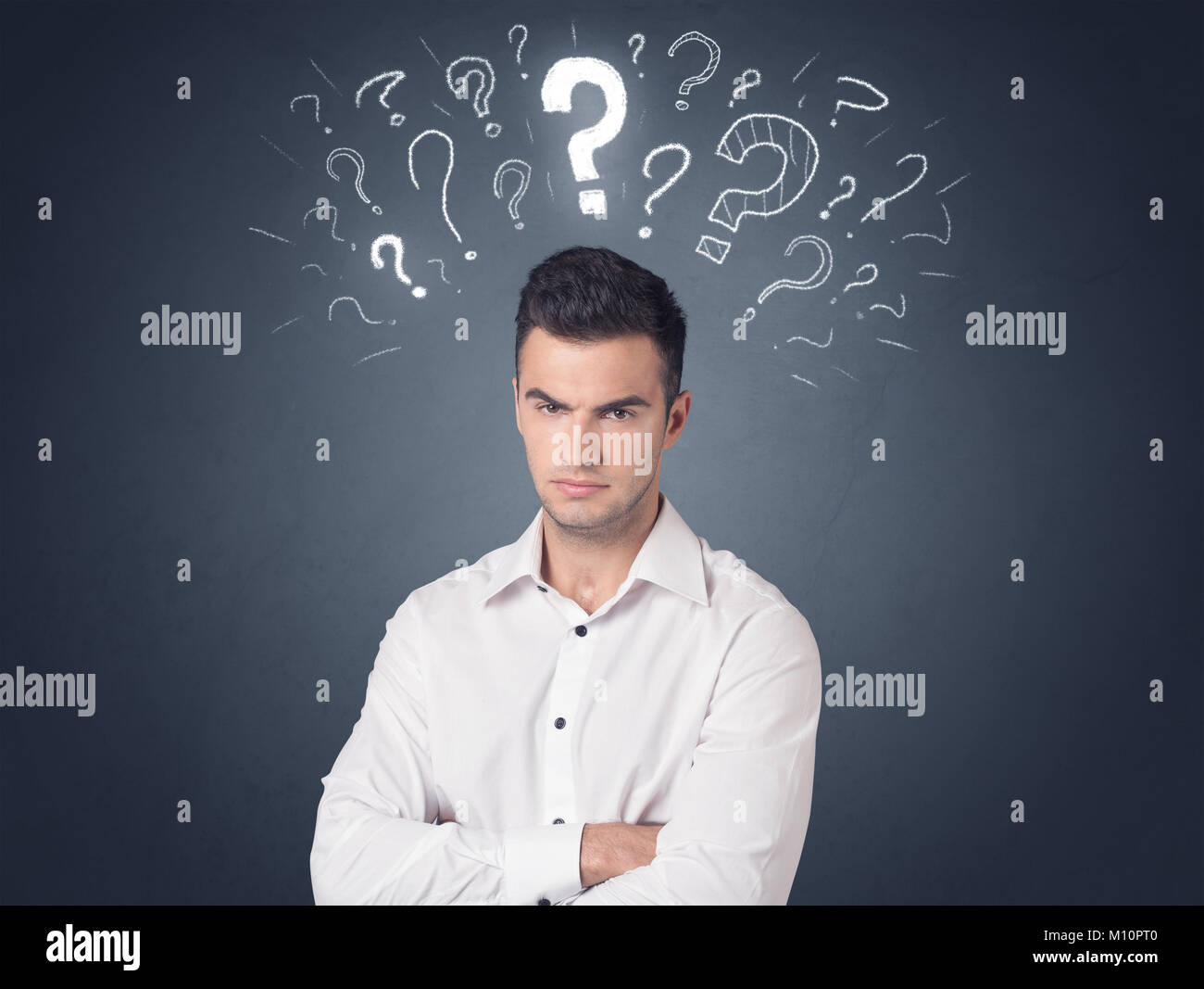 Young casual businessman with white question marks above his head Stock ...