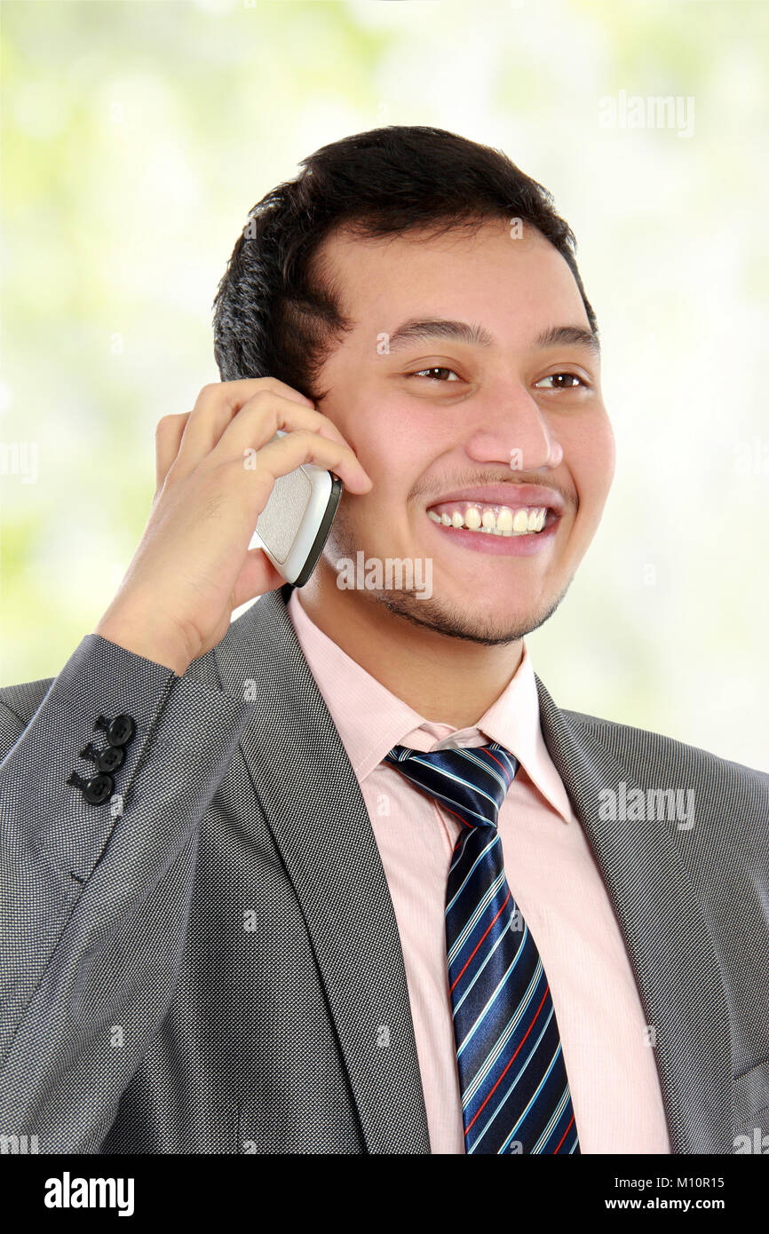 Closeup portrait of handsome business man using cell phone, smiling ...