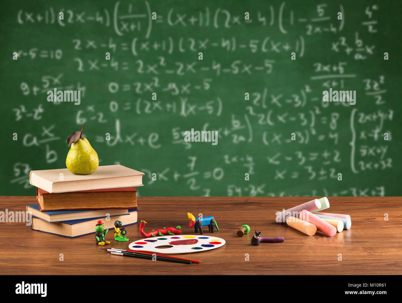 Back to school concept with long numbers calculation on blackboard and ...