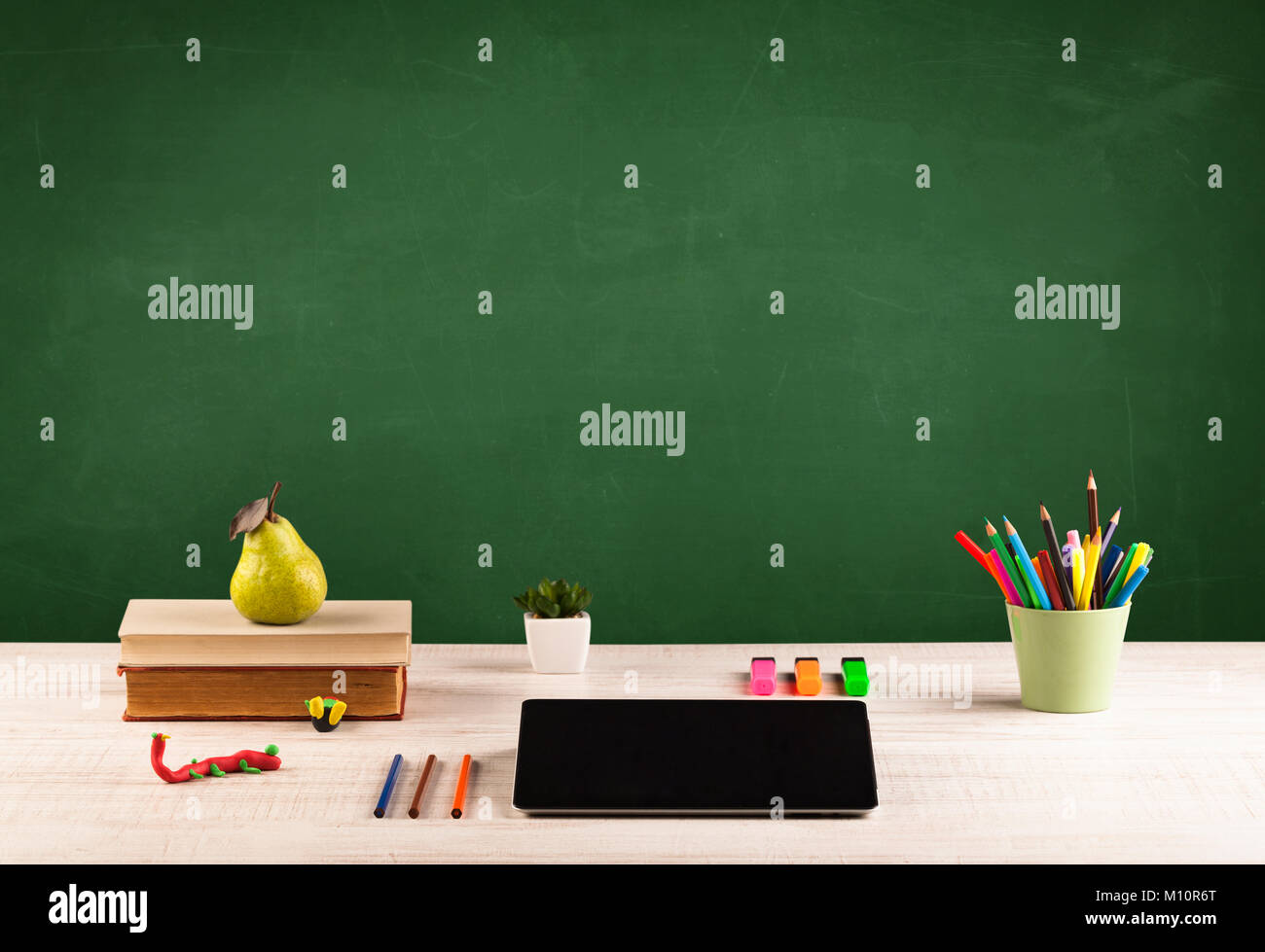 Back to school concepty with clear blackboard background, desk, items ...