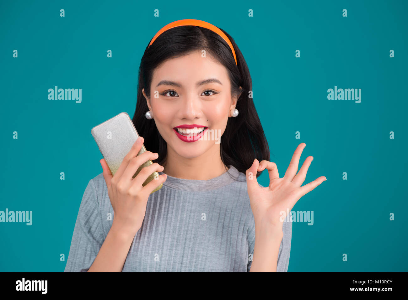 Close Up Of Smiling Lovely Pinup Asian Girl Taking Selfie Photo Over