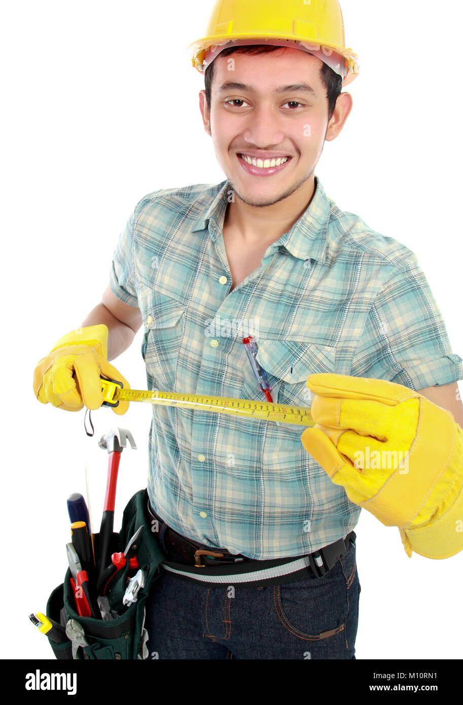 Portrait of an smiling happy worker using measuring tool Stock Photo ...