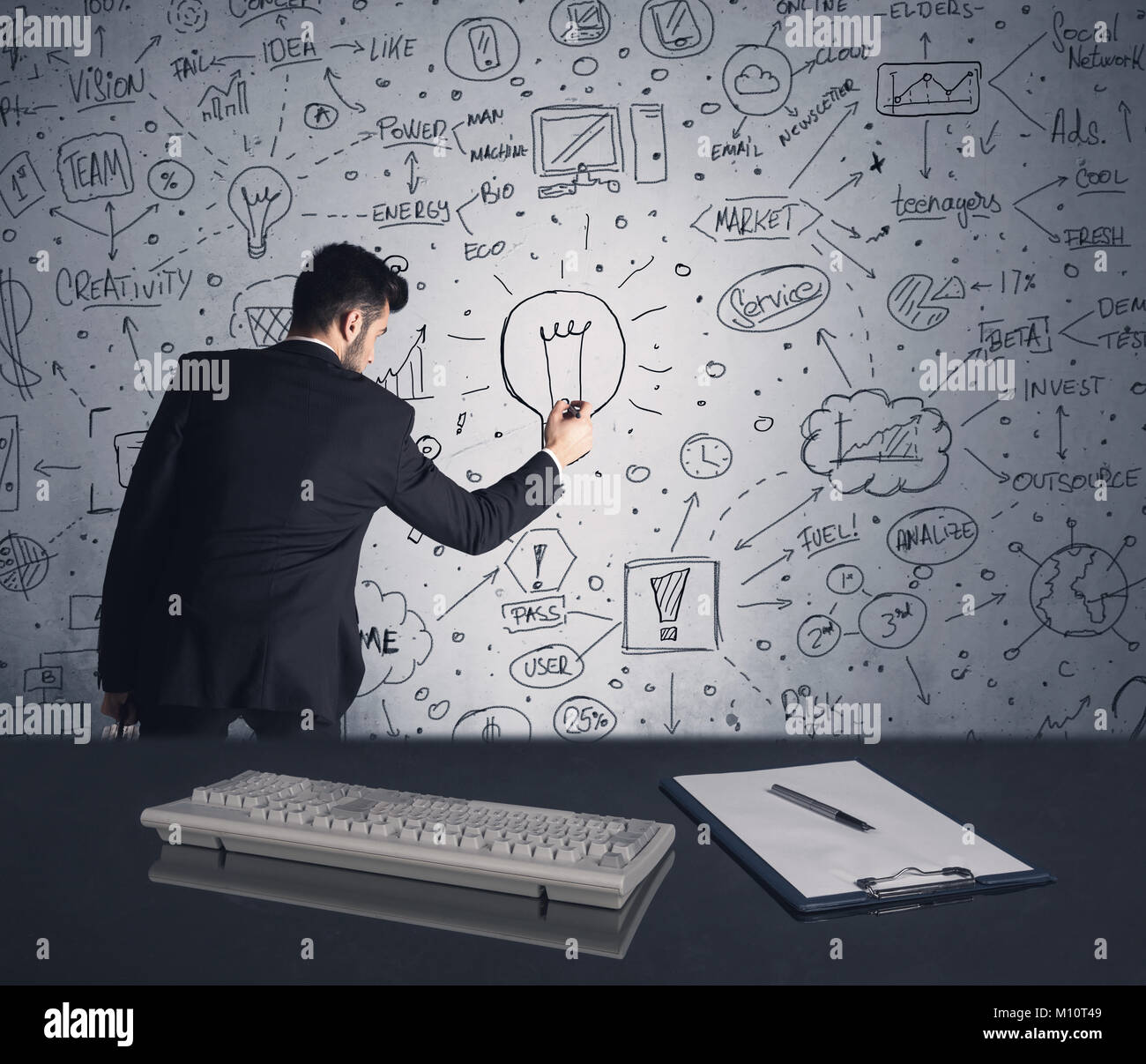 An intelligent office worker drawing strategy ideas and future plan ...