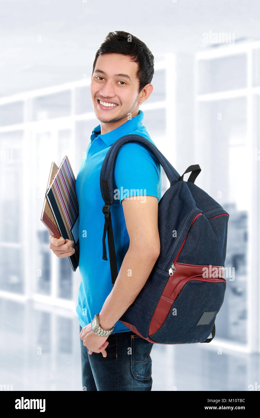 Happy smiling college student in campus Stock Photo - Alamy