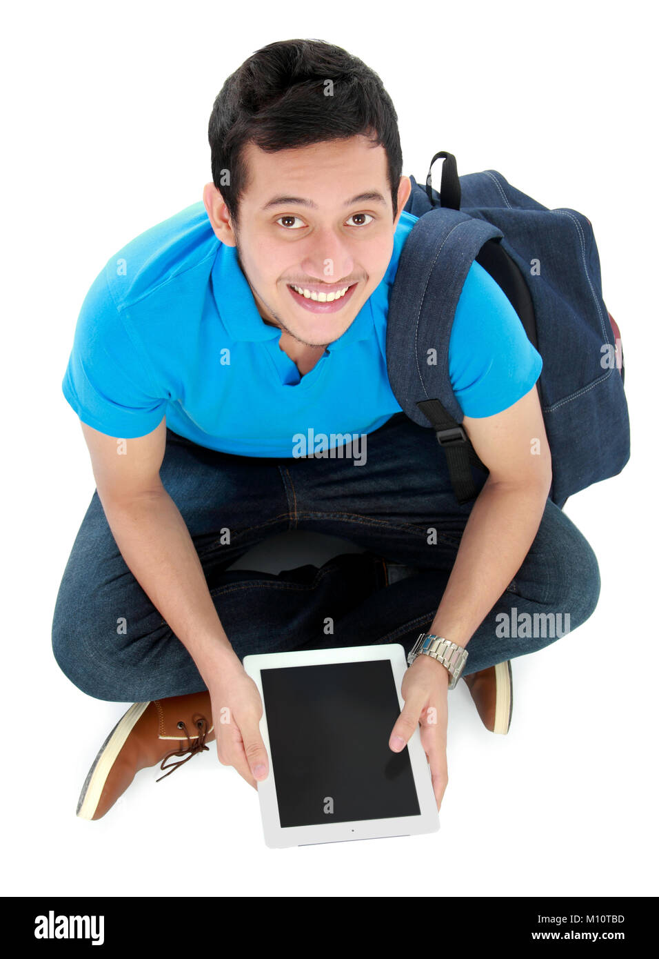 Happy smiling college student sit on the floor with tablet pc Stock ...