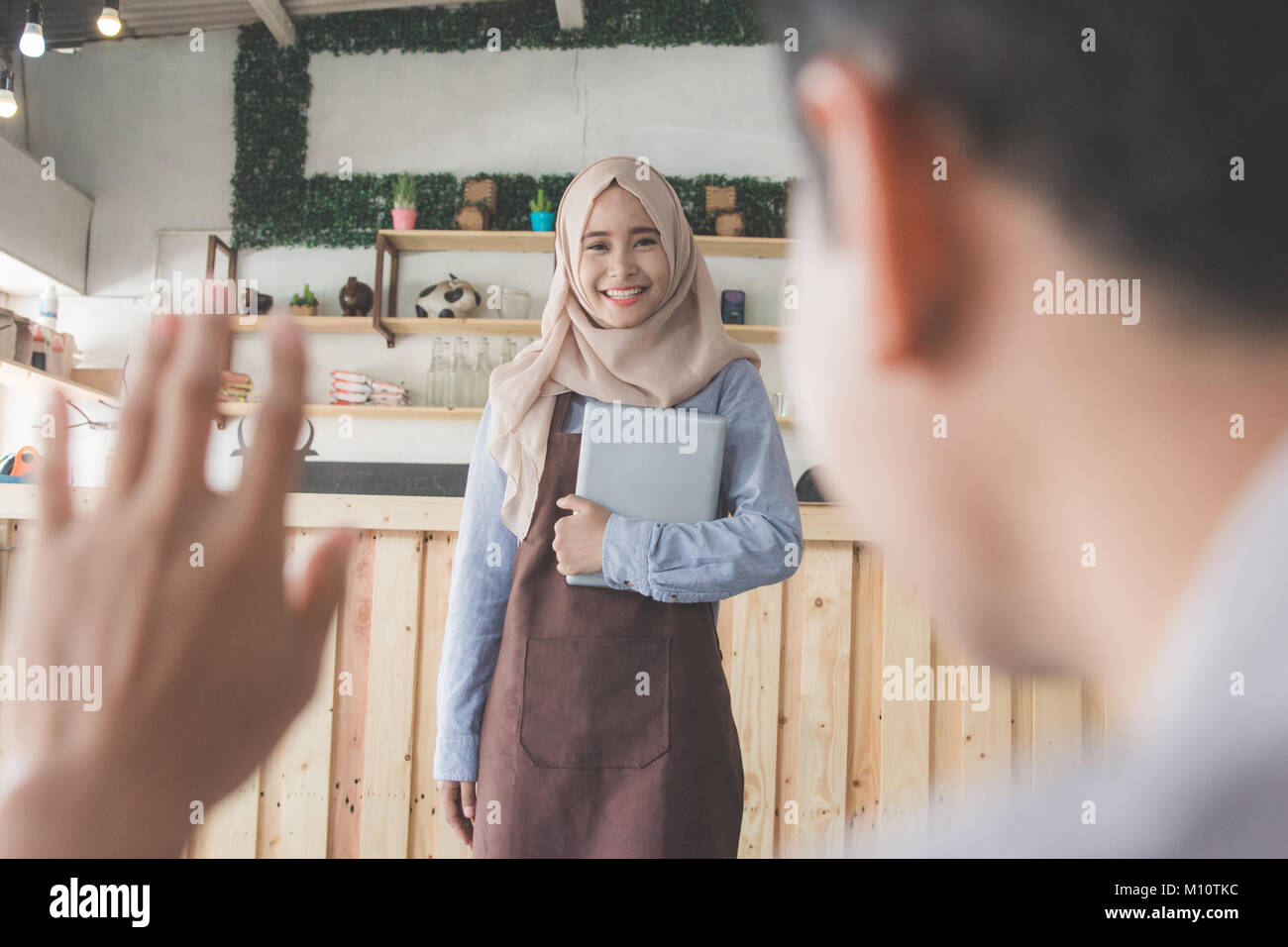 Restaurant customer calling waiter hi-res stock photography and images ...