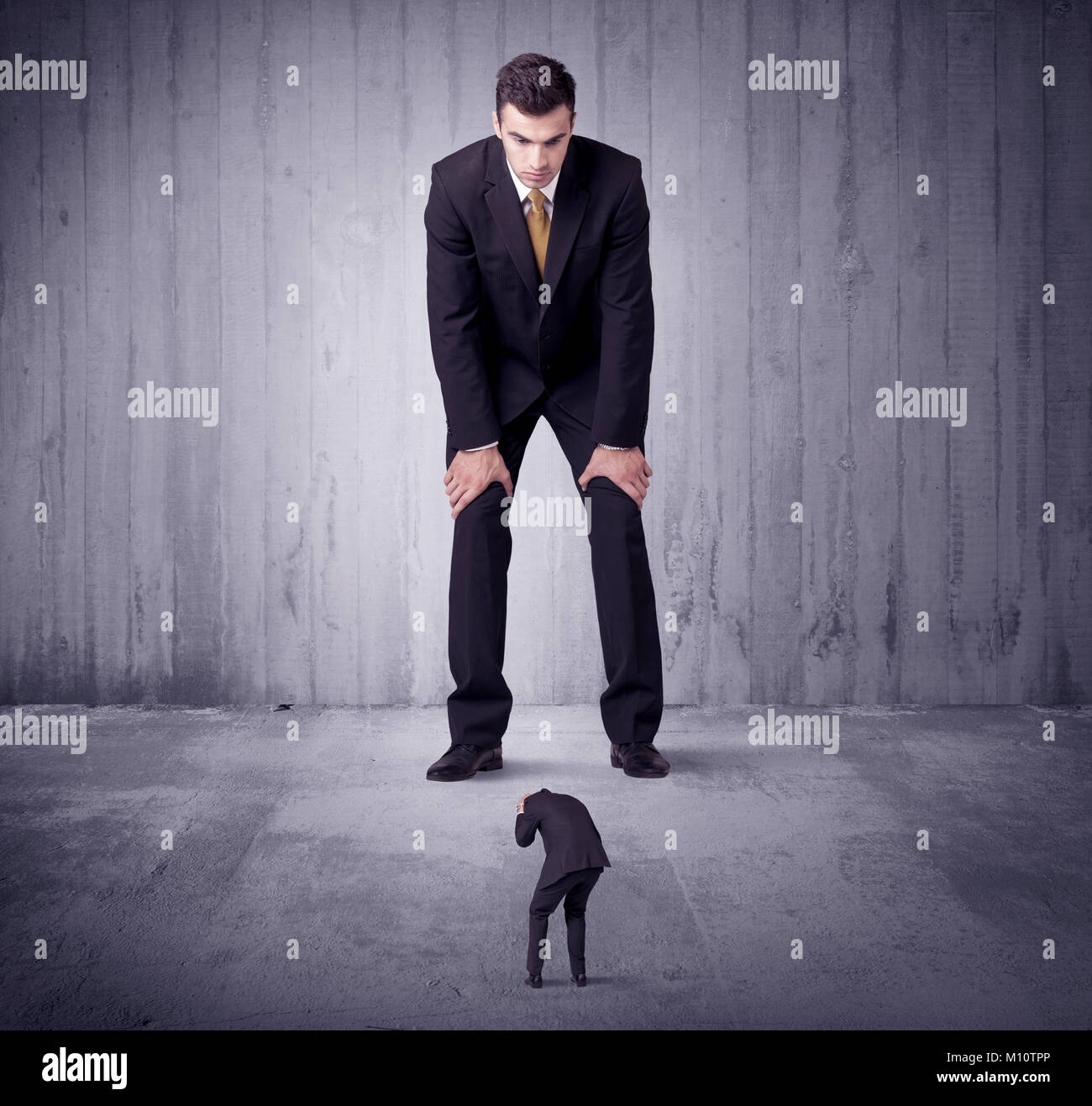 Huge boss manager lokking at small business man concept on background ...